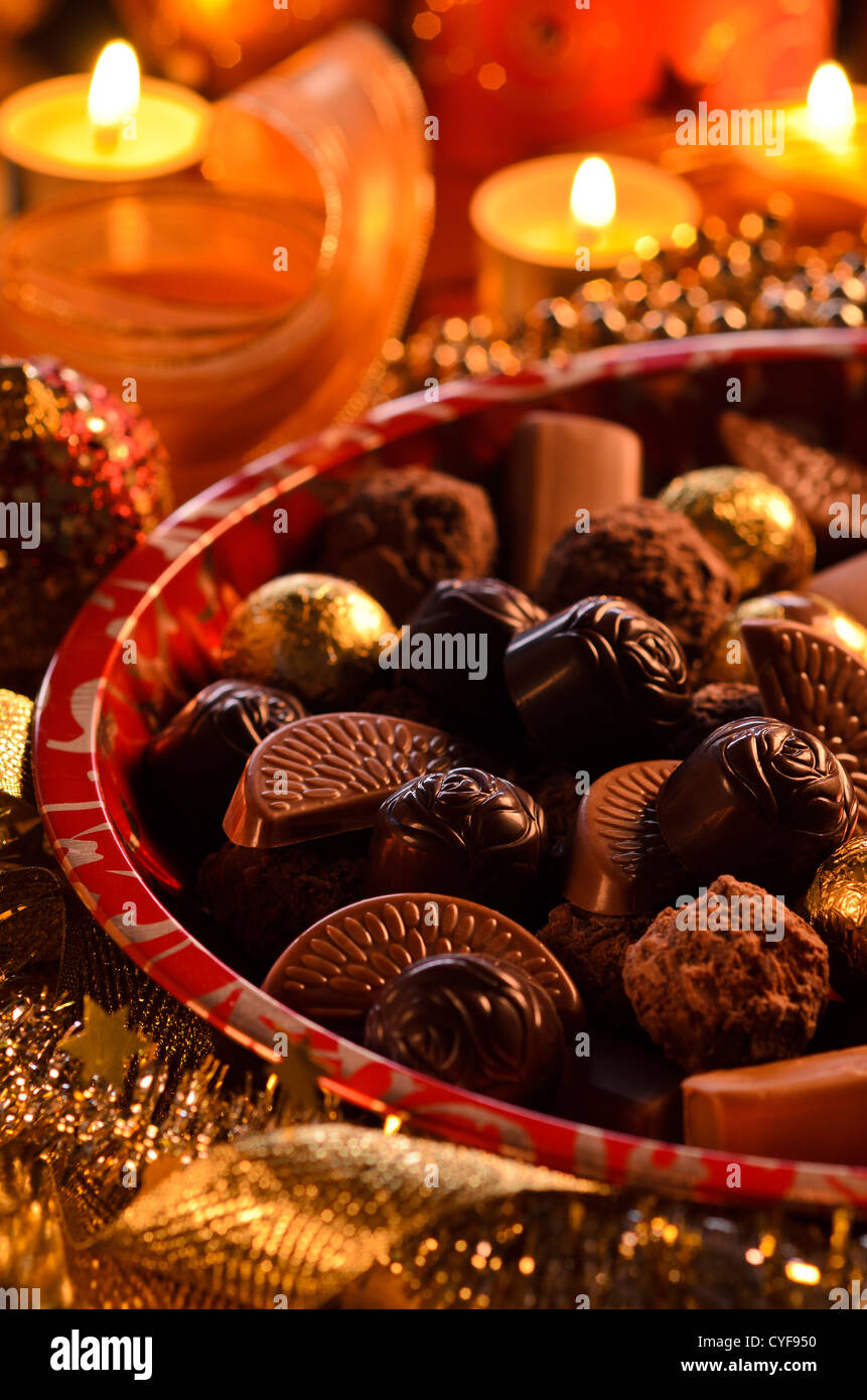 Assortment of chocolate pralines and Christmas decoration Stock Photo ...