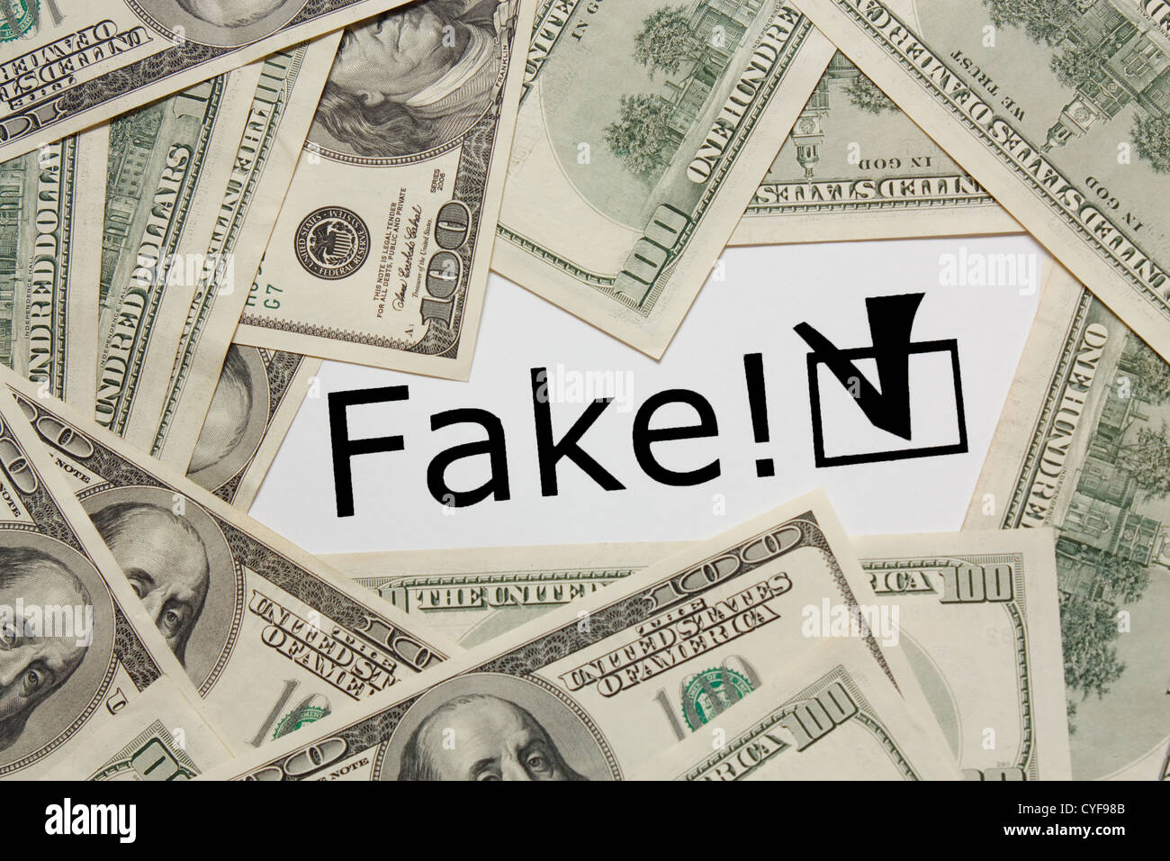 Dollars on white background with text 'Fake!' Stock Photo - Alamy