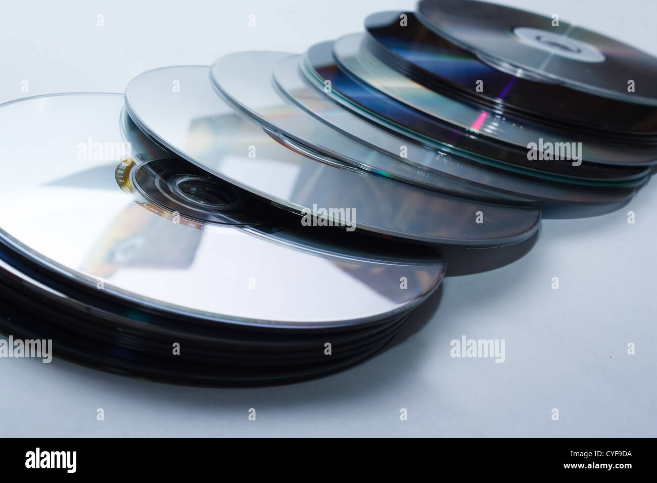 Heap of CD on the white-blue background Stock Photo - Alamy