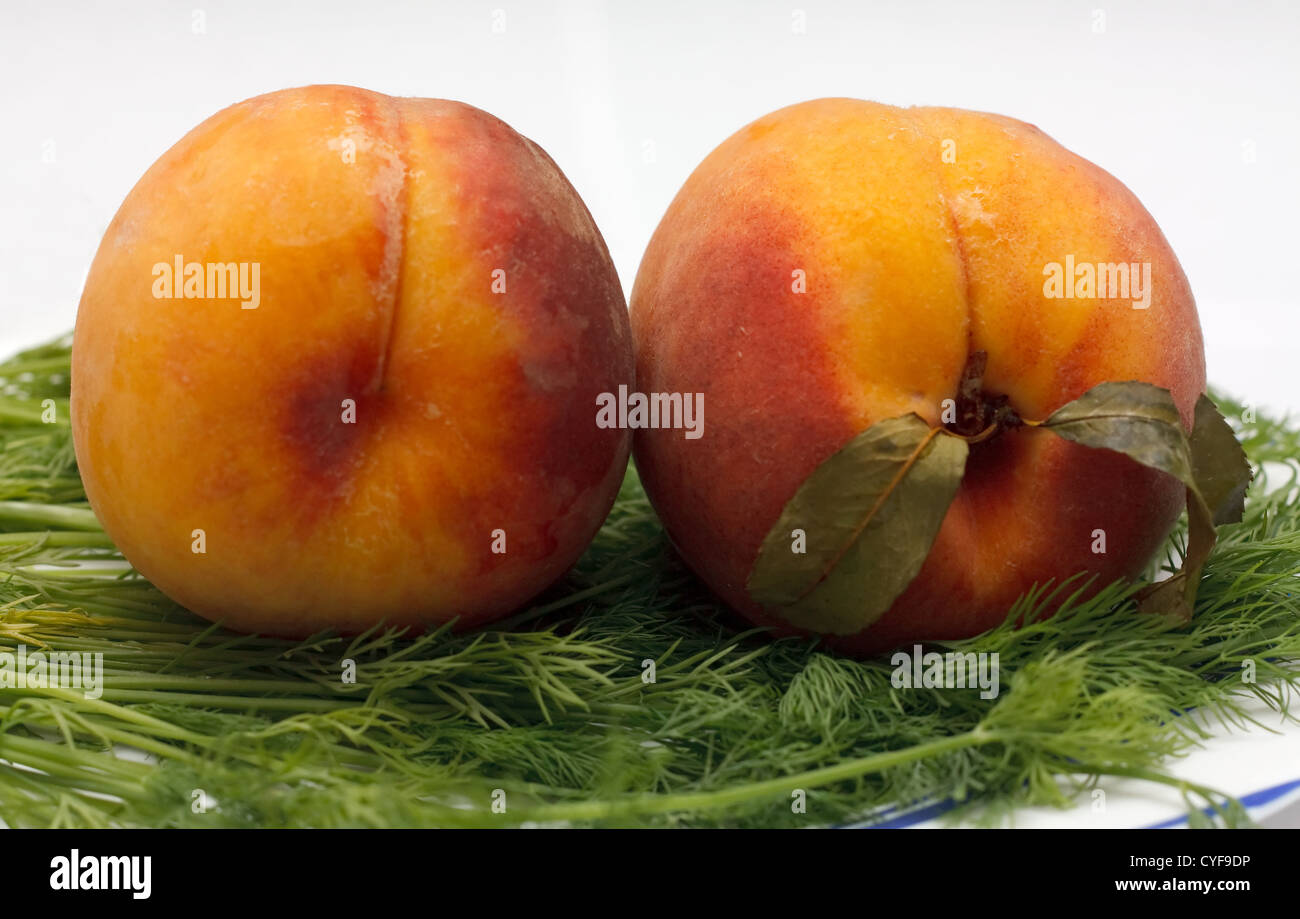 two peach on wite background Stock Photo - Alamy