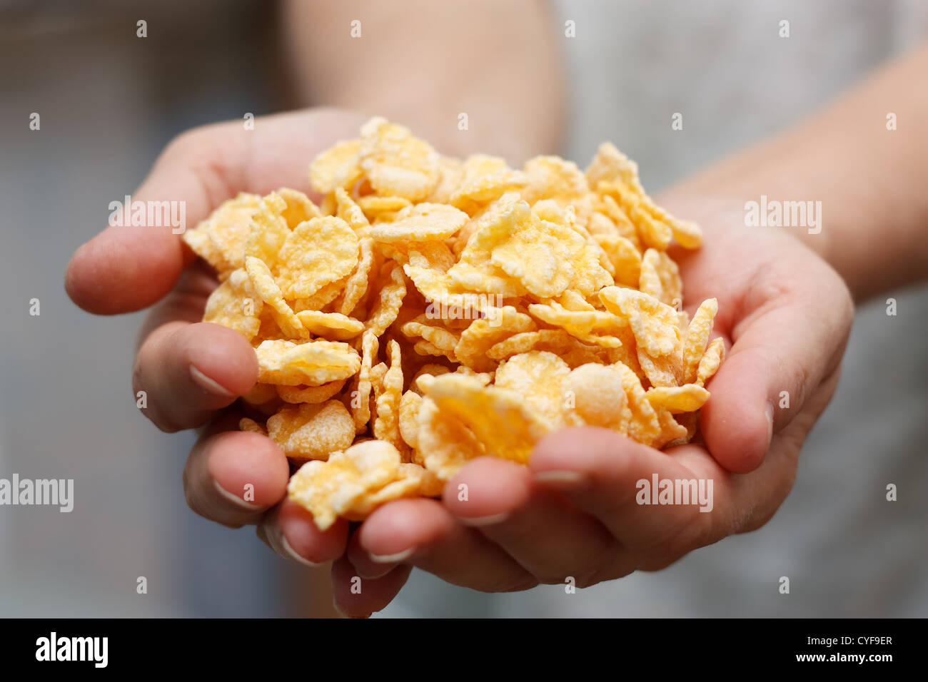 corn flakes in hands Stock Photo - Alamy