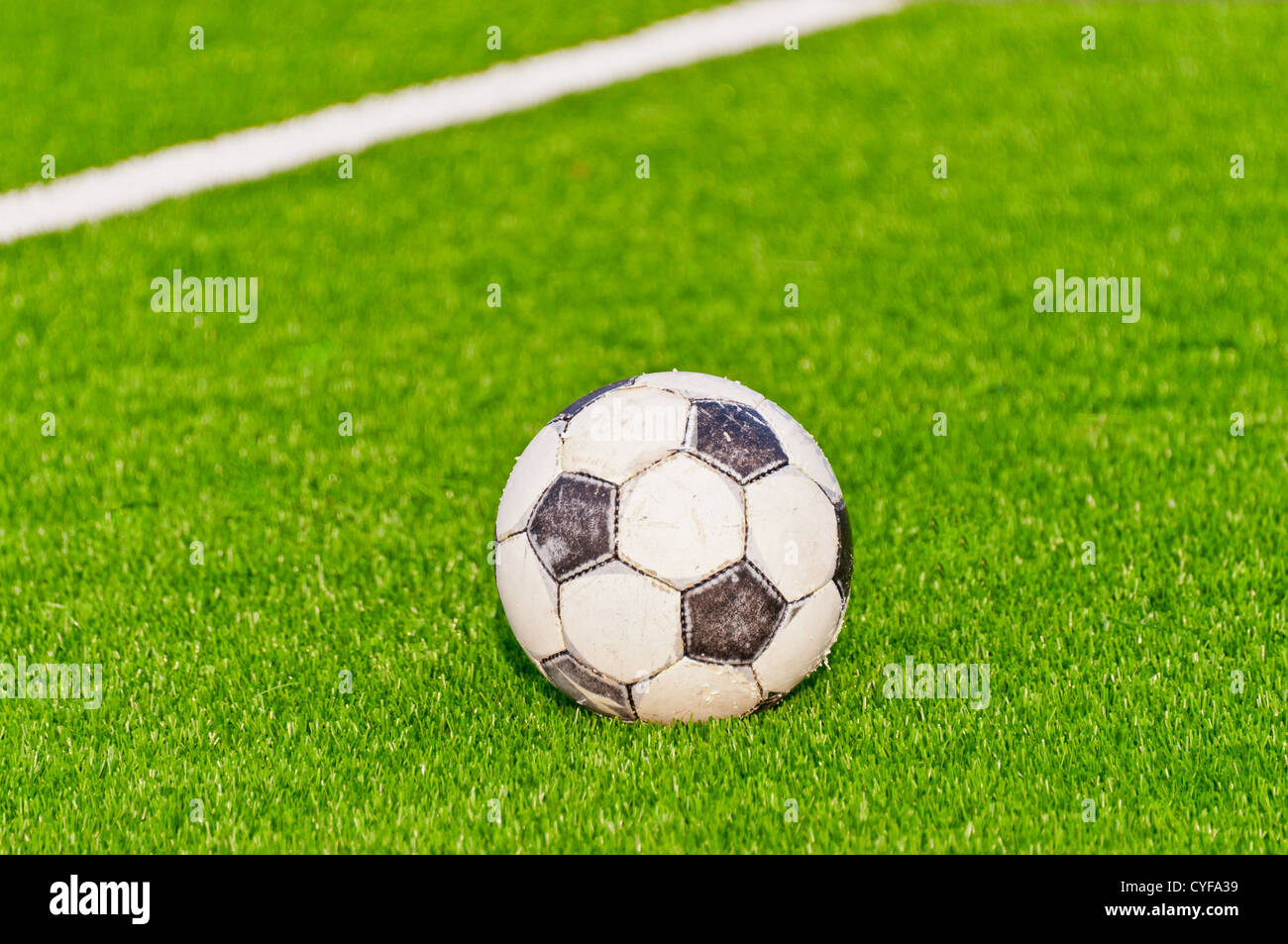 Soccer ball on a football field Stock Photo - Alamy