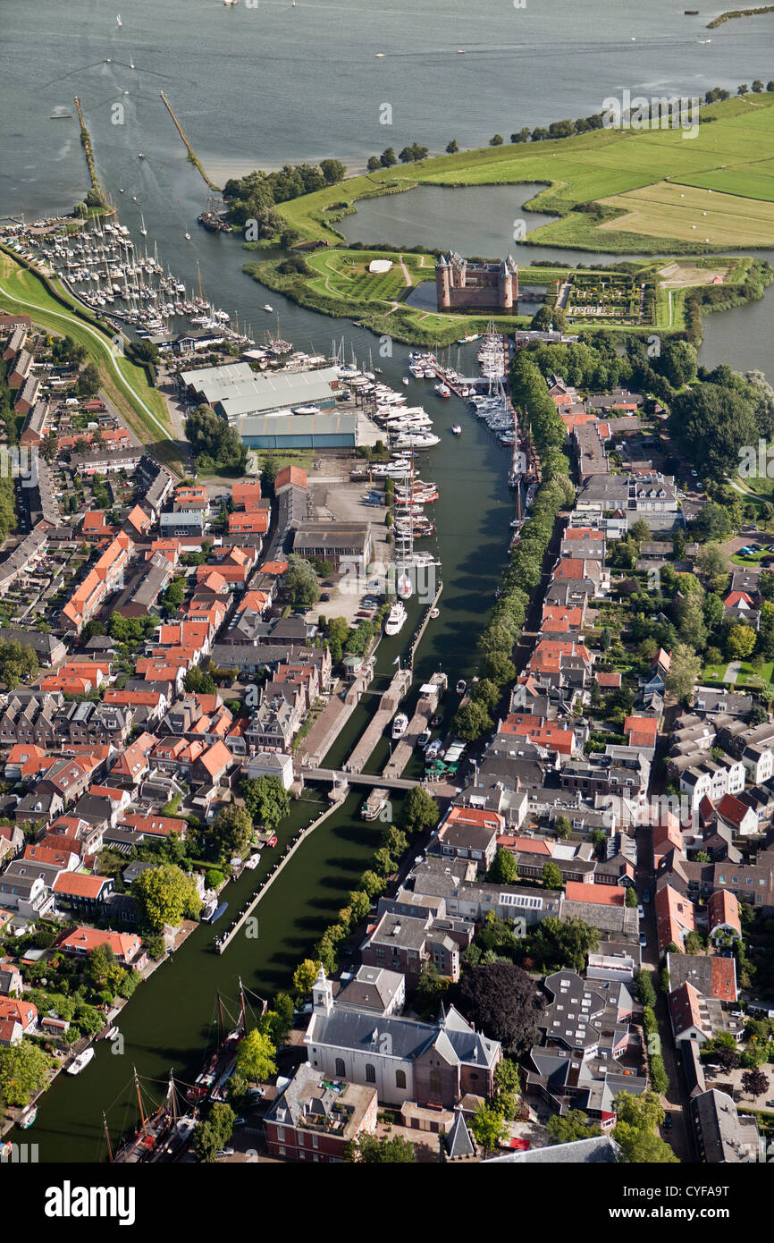 The Netherlands, Muiden. Sluices in center of city. Castle called ...