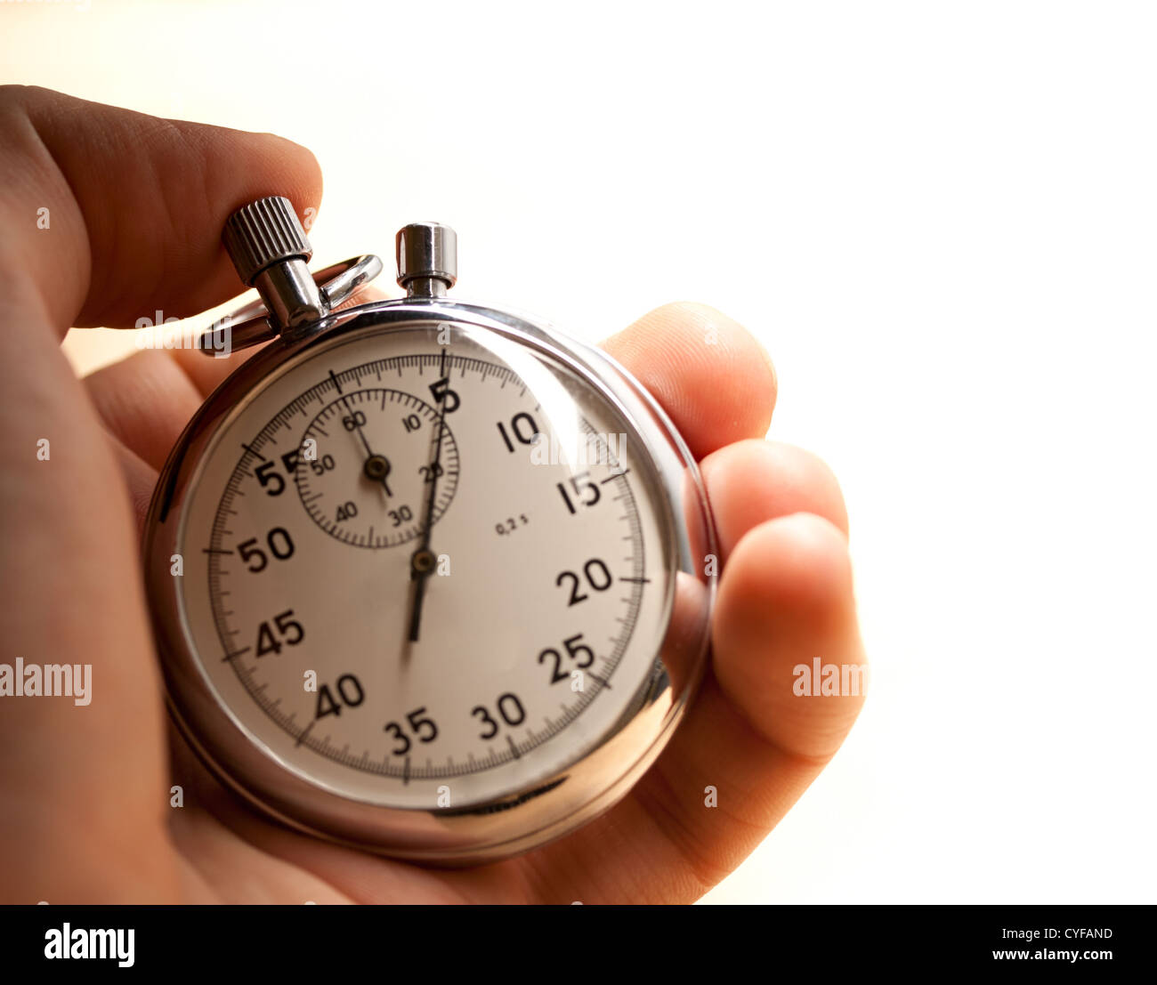 Hand holding stopwatch Stock Photo - Alamy