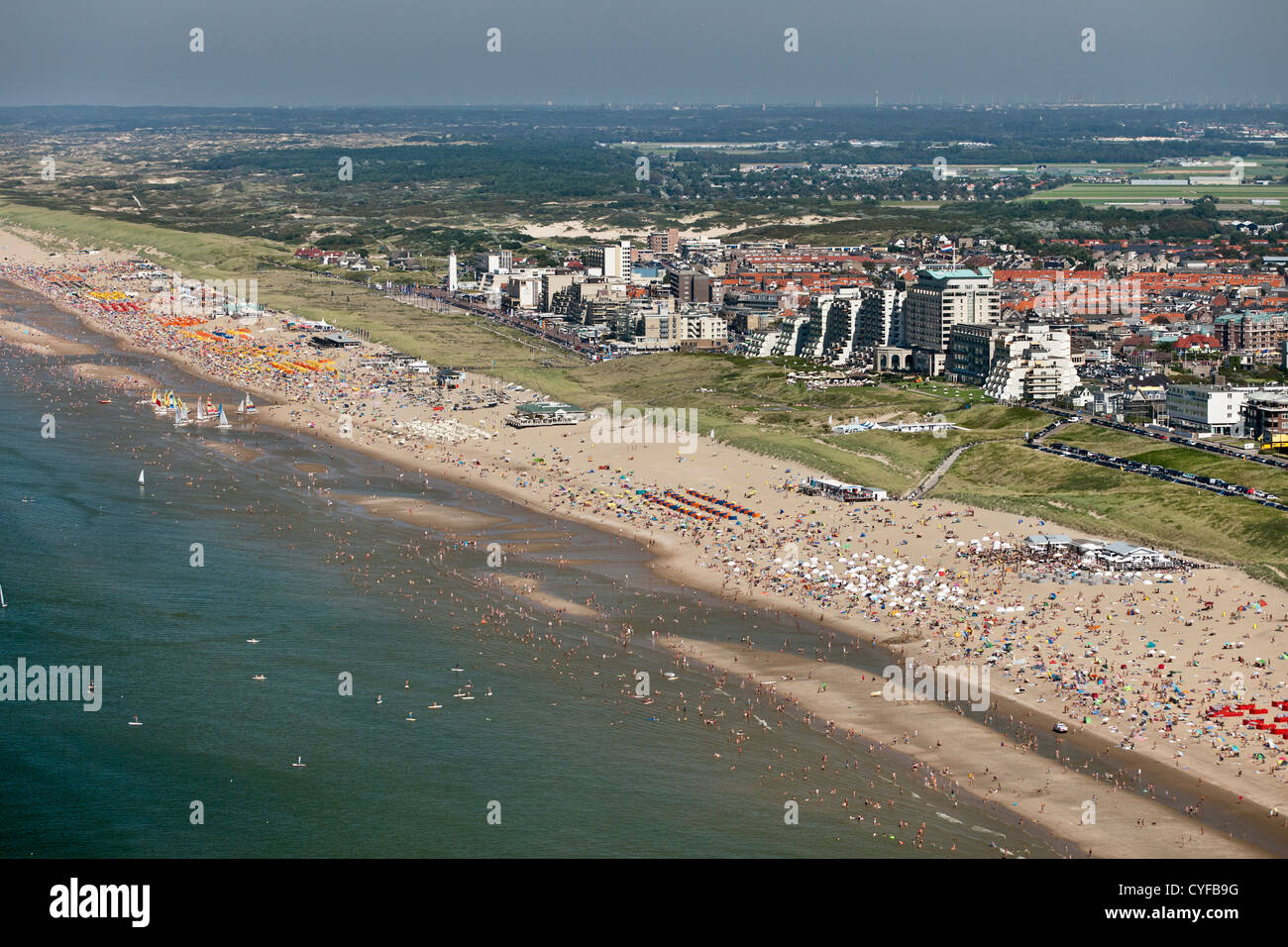 The Netherlands, Noordwijk. People sunbathing and swimming at beach of ...