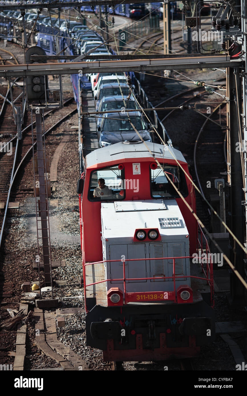 Cars being transported by rail Stock Photo - Alamy