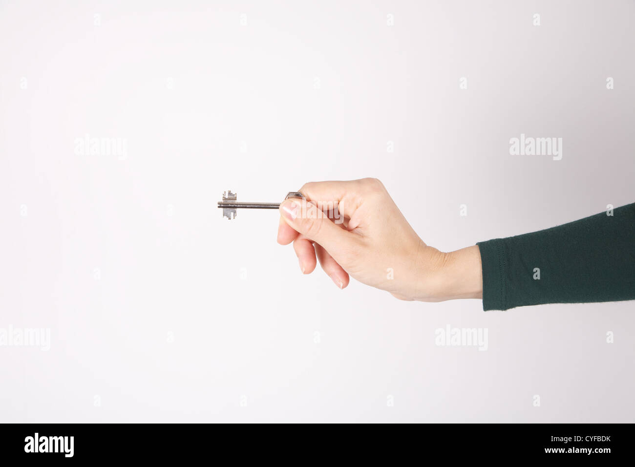 woman detail holding a key in her hand Stock Photo - Alamy