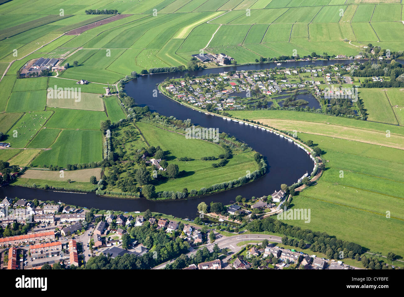 The Netherlands, Nigtevecht. River Vecht. Windmill, holiday houses and ...