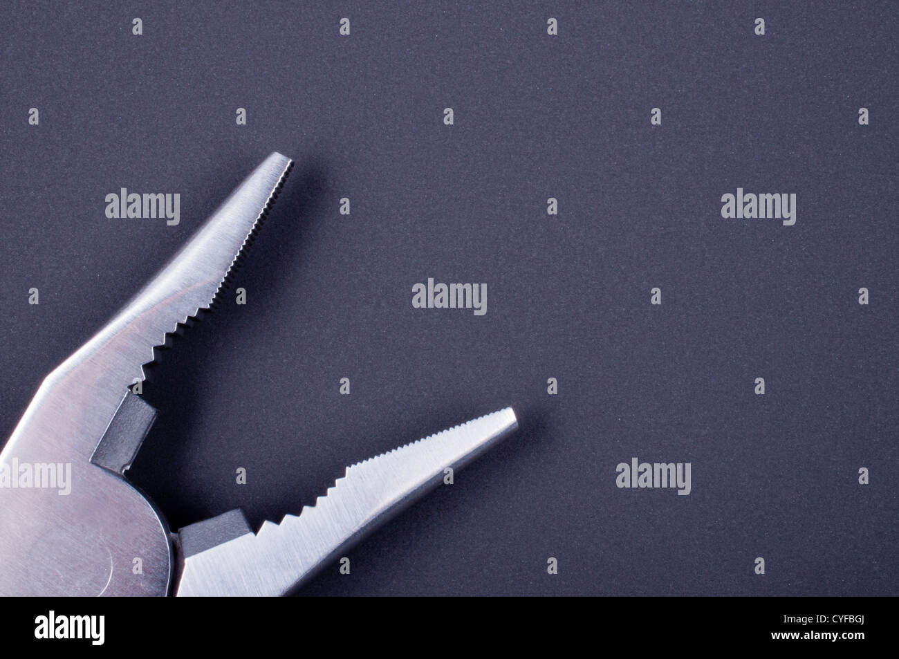 Close up pliers on a black background Stock Photo - Alamy