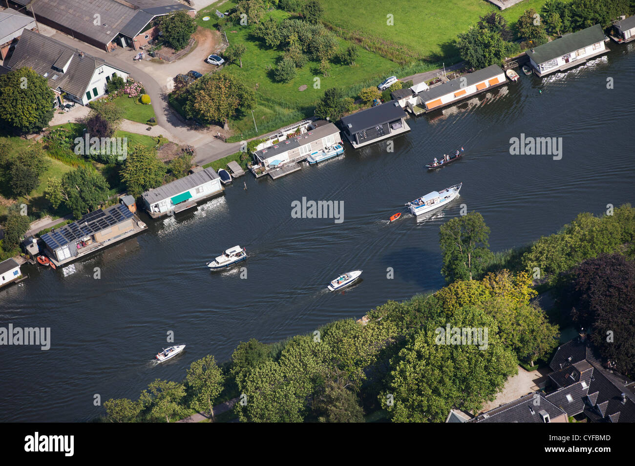 The Netherlands, Nigtevecht. River Vecht. Pleasure boats passing ...