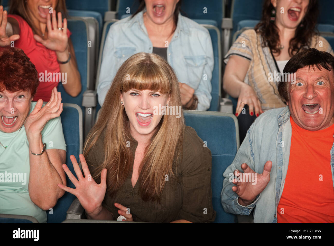 Group of screaming people at the movies Stock Photo - Alamy