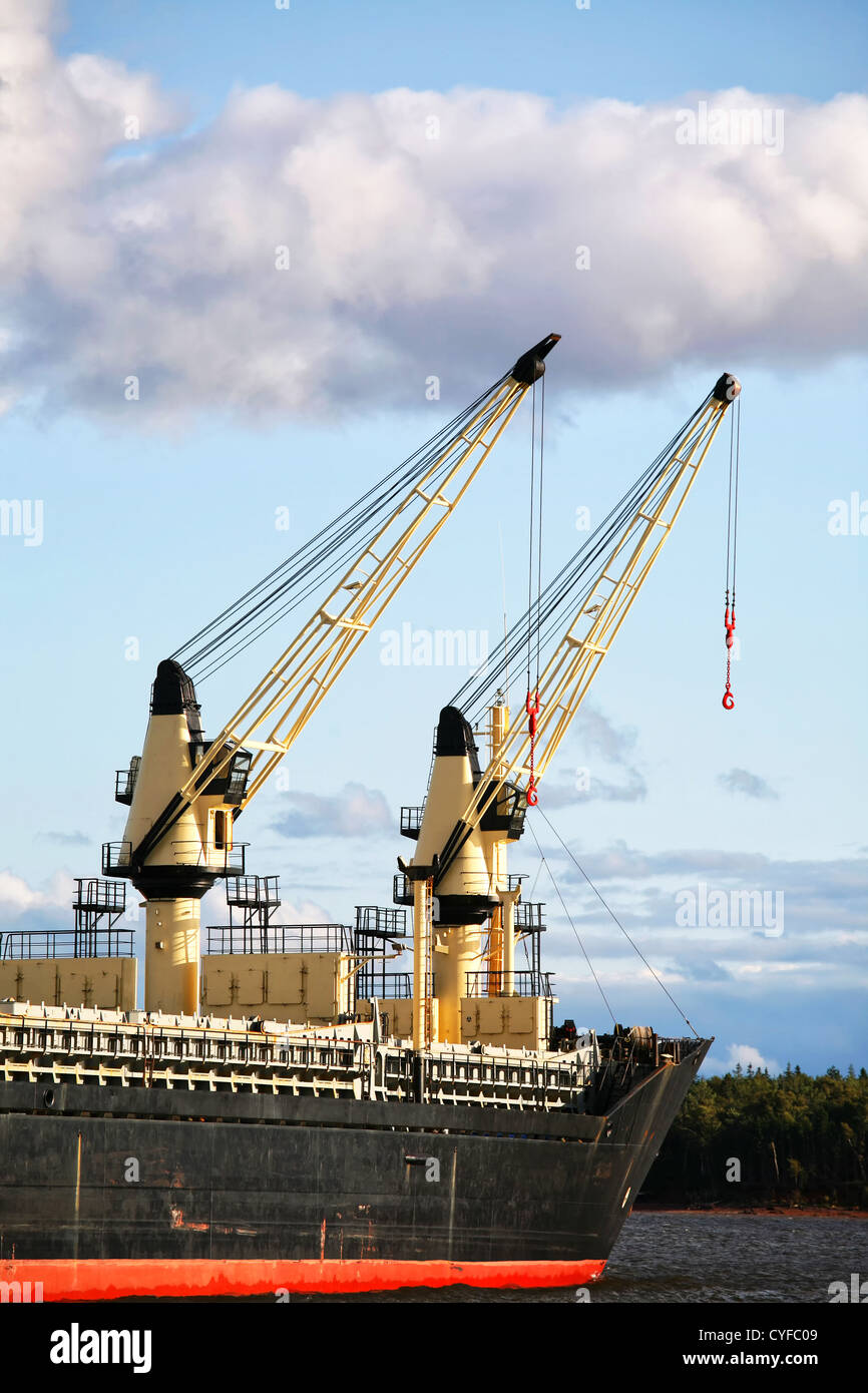Two ship's cranes on an ocean going container ship Stock Photo - Alamy