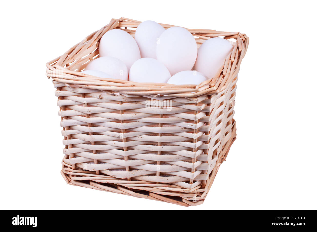 Wicker basket full of chicken eggs isolated Stock Photo - Alamy