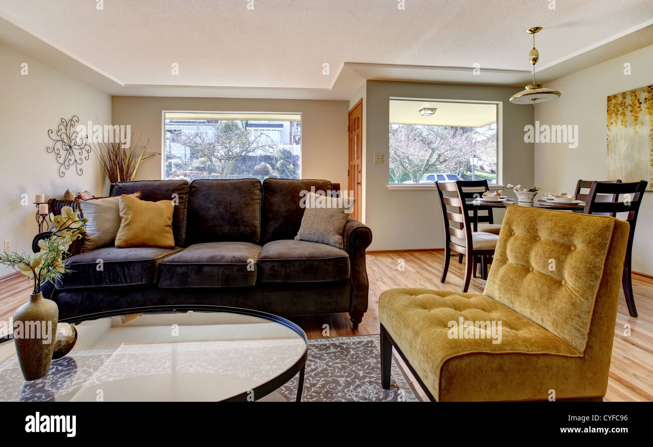 Living room interior with brown and yellow furniture Stock Photo - Alamy