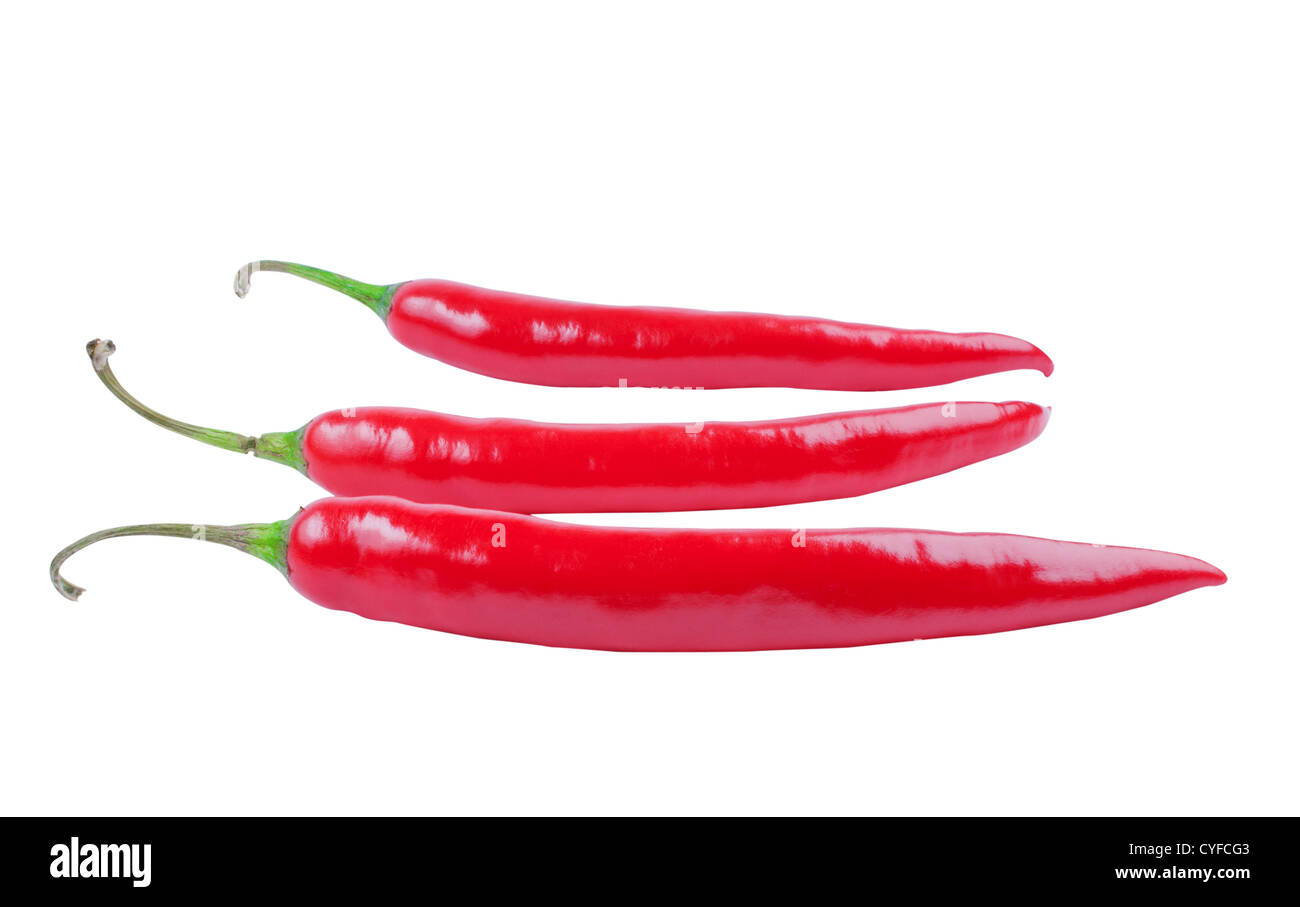 Three chili peppers in the white background Stock Photo - Alamy