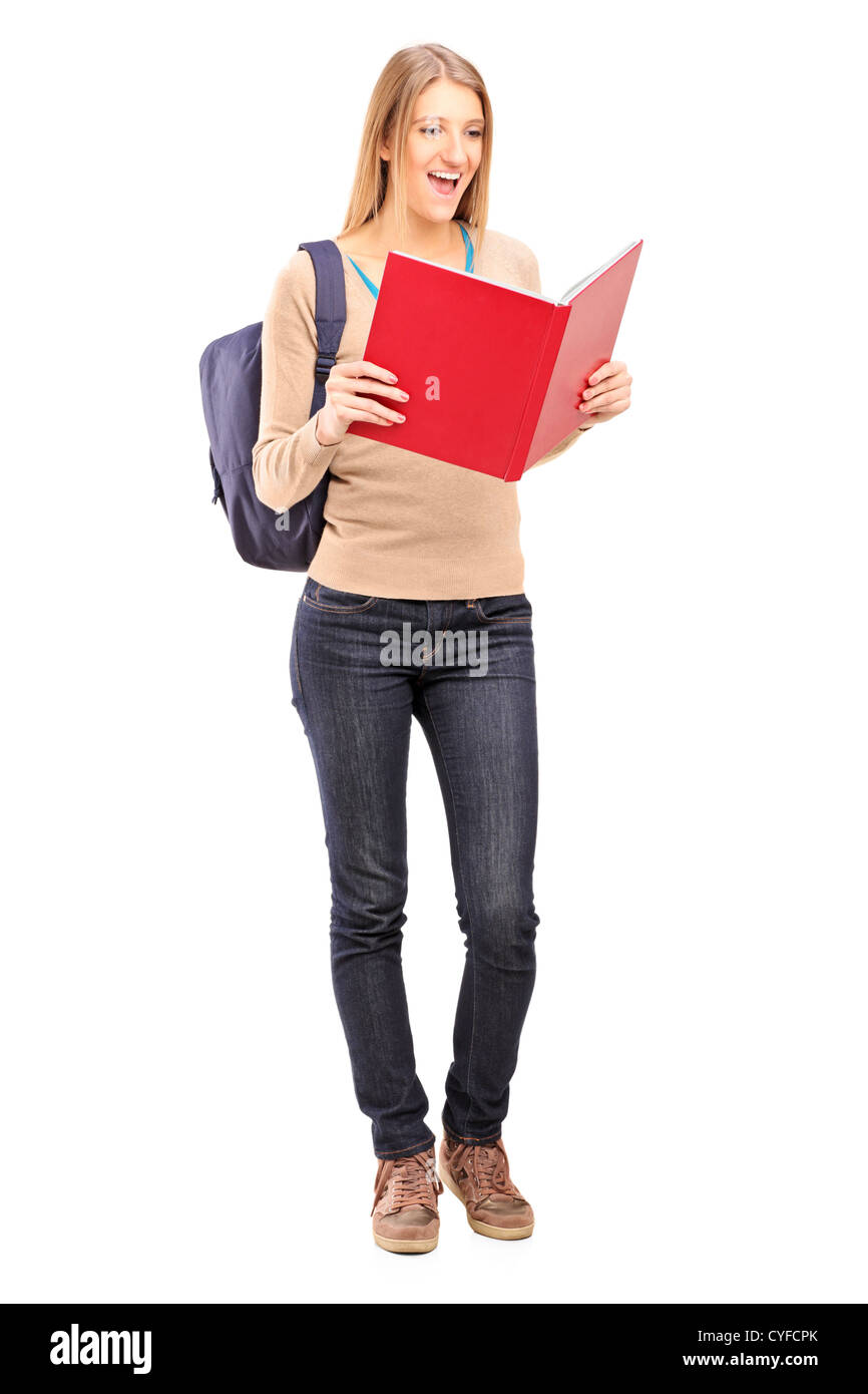 Full length portrait of a female student reading a book isolated ...