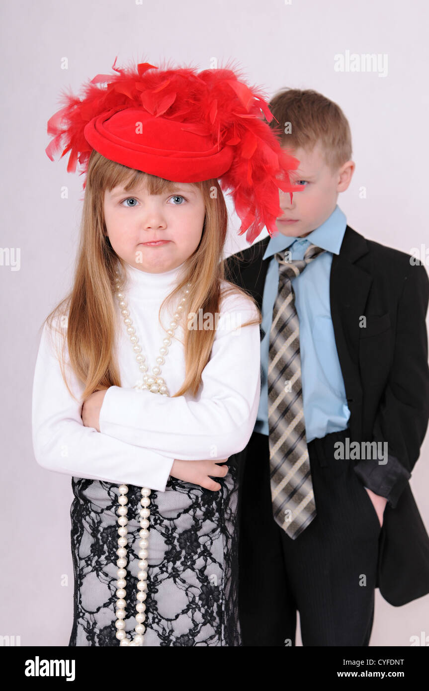 sad girl in a red hat waiting for an apology from the boy Stock Photo ...