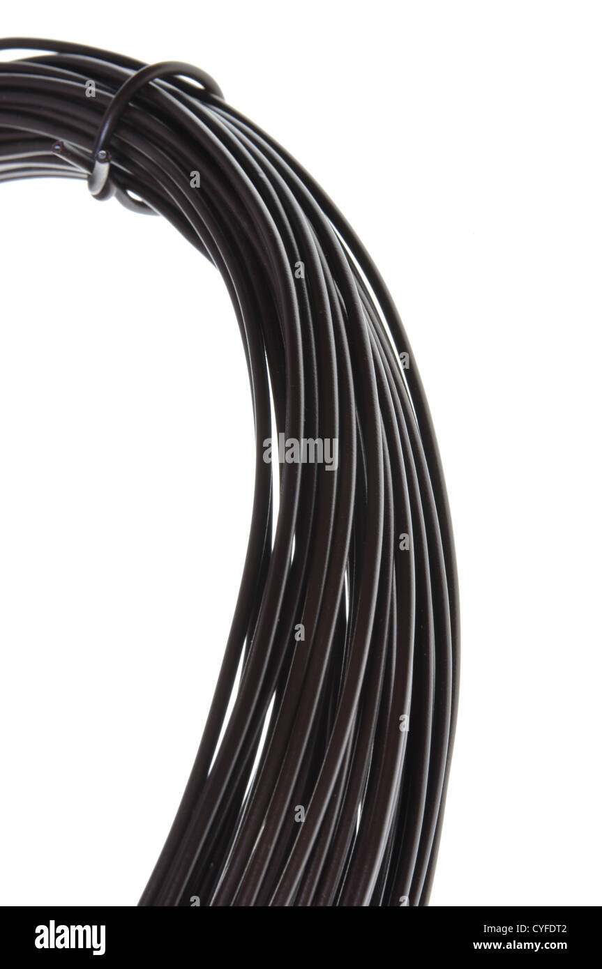 Bundle of black cables isolated on white background Stock Photo - Alamy
