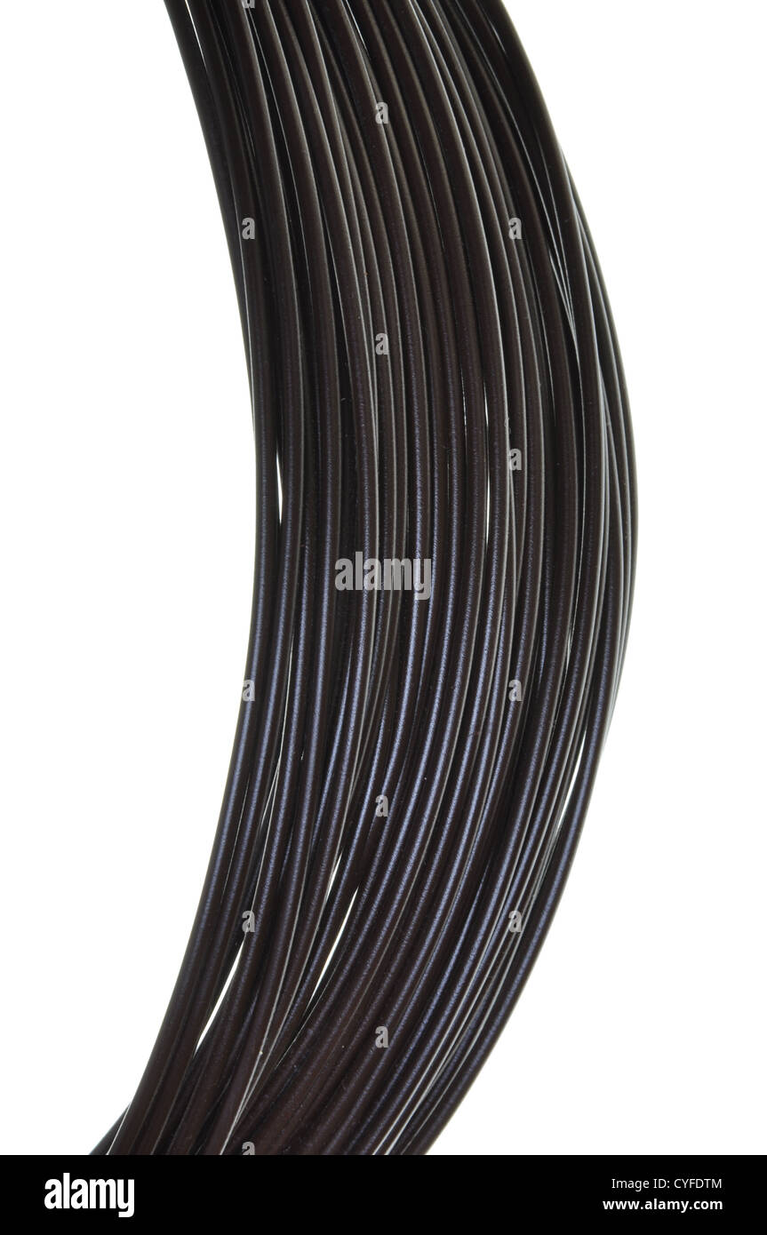 Bundle of black cables isolated on white background Stock Photo - Alamy