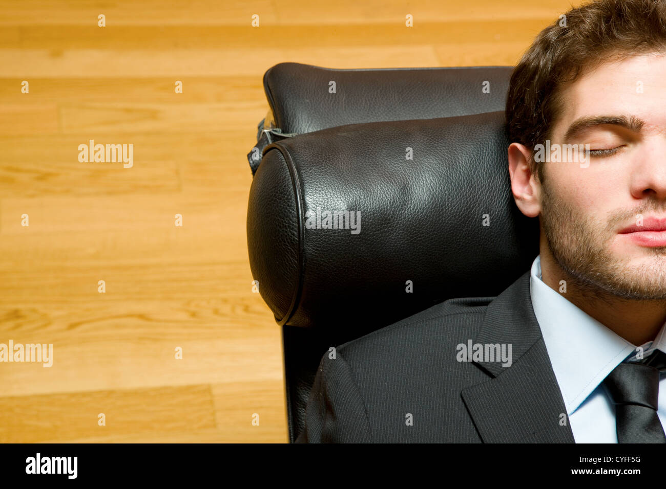 man lying on chaise longue Stock Photo - Alamy