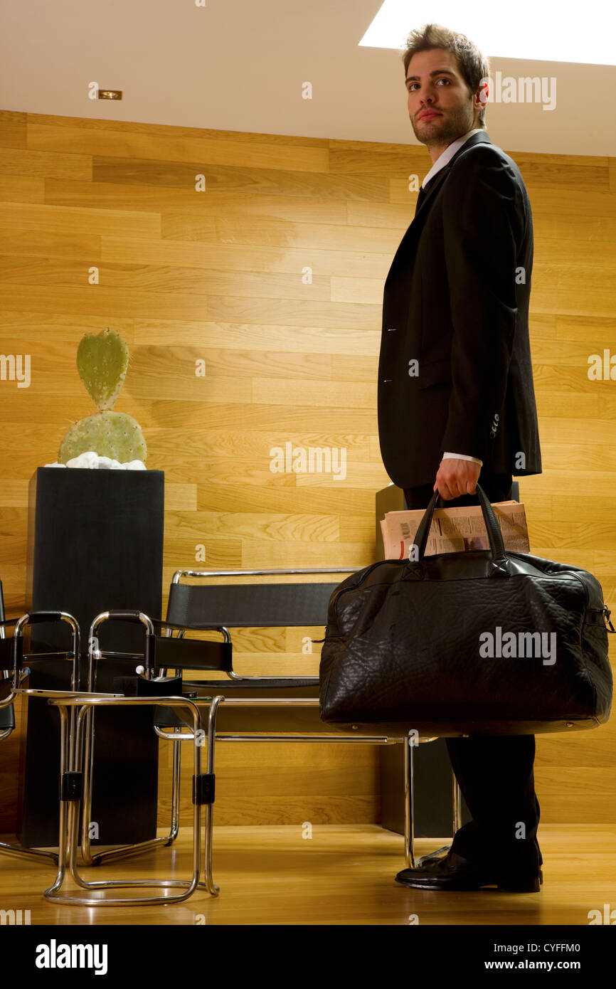 business man waiting in office lobby Stock Photo - Alamy