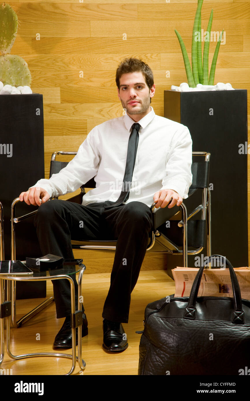 business man waiting in office lobby Stock Photo - Alamy