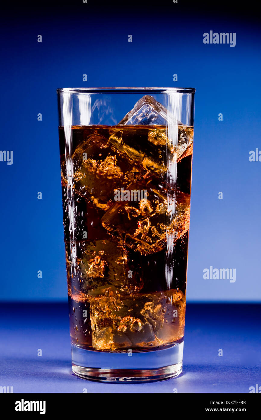 Photo of delicious cold glass with cola and ice cubes Stock Photo - Alamy