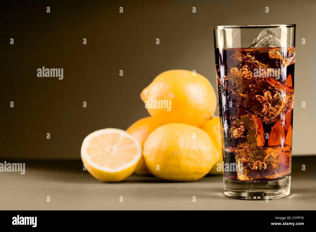 photo of delicious lemon ice team with ice cubes on sepia background ...