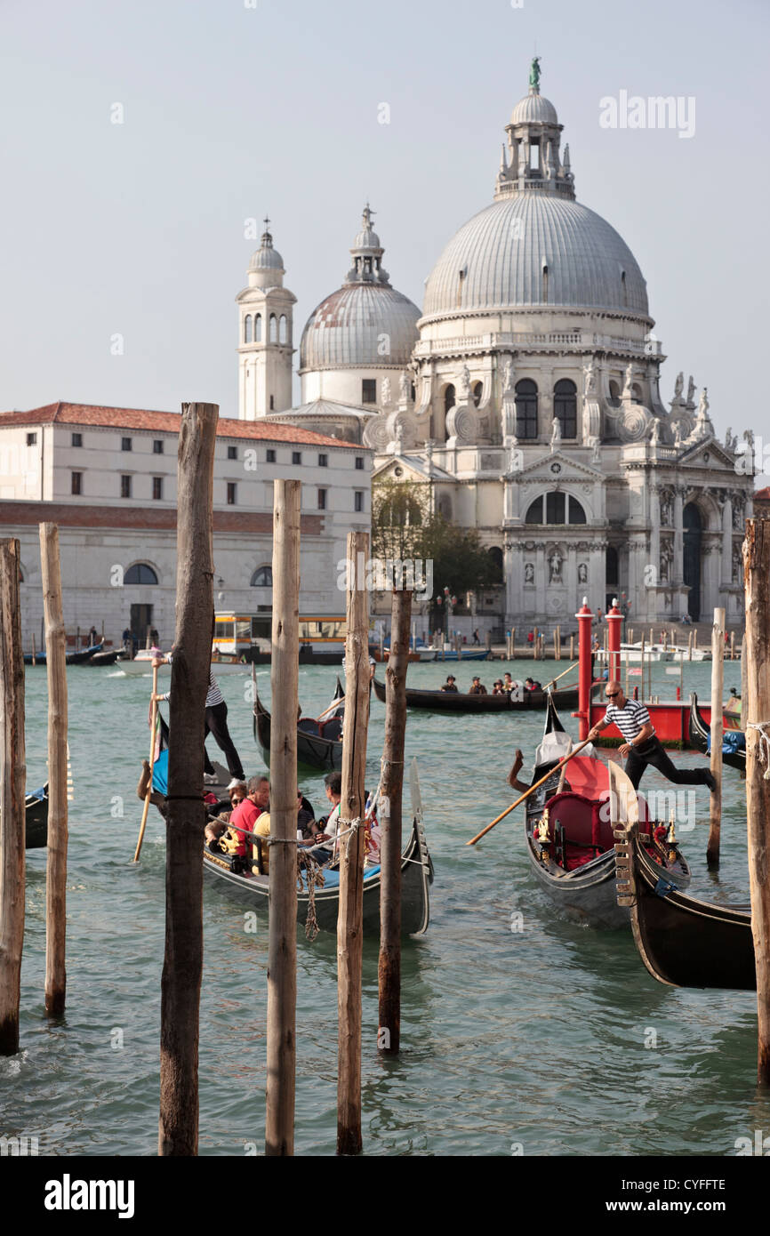 Gondolas loading and unloading on the Grand Canal in Venice Stock Photo ...