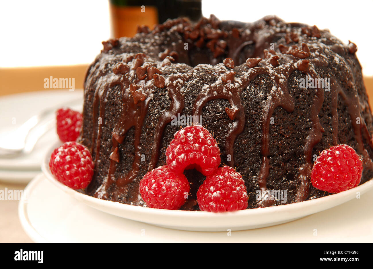 Chocolate fudge cake with raspberries, champagne in a romantic holiday ...