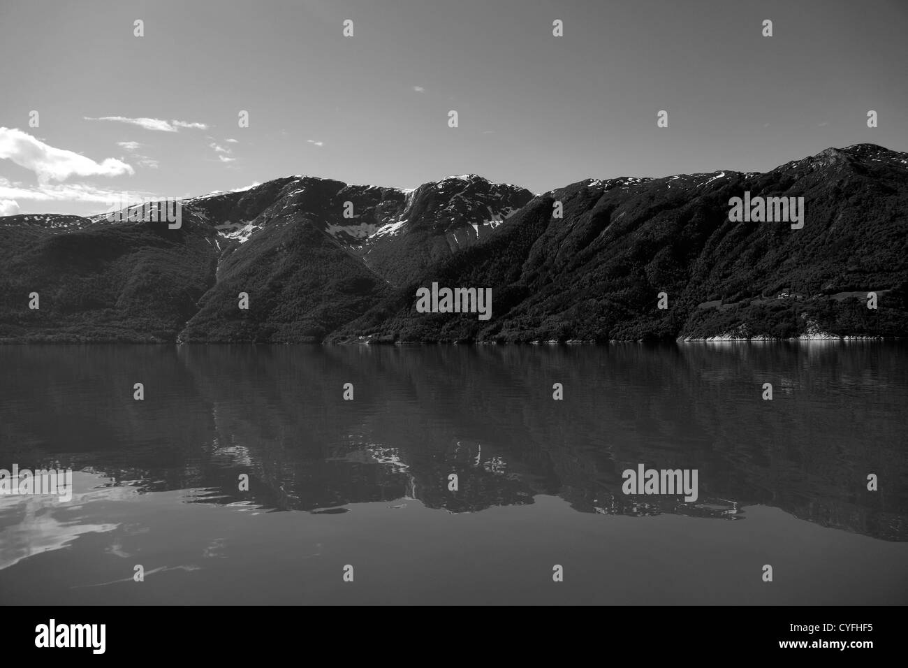 Reflections of mountains surrounding Hardangerfjord Fjord, Hordaland ...