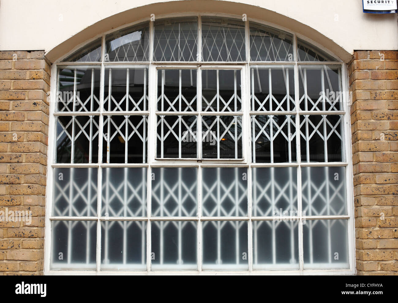 A security grill on a window in London, England, U.K Stock Photo - Alamy
