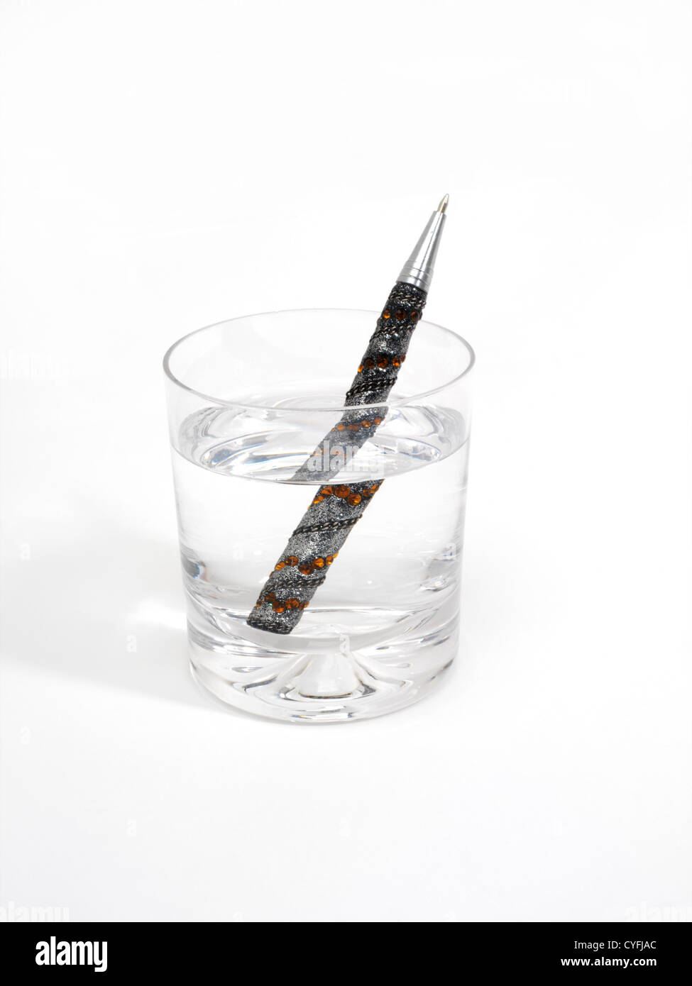 Refraction Pen Refracting in a Glass of Water Stock Photo - Alamy
