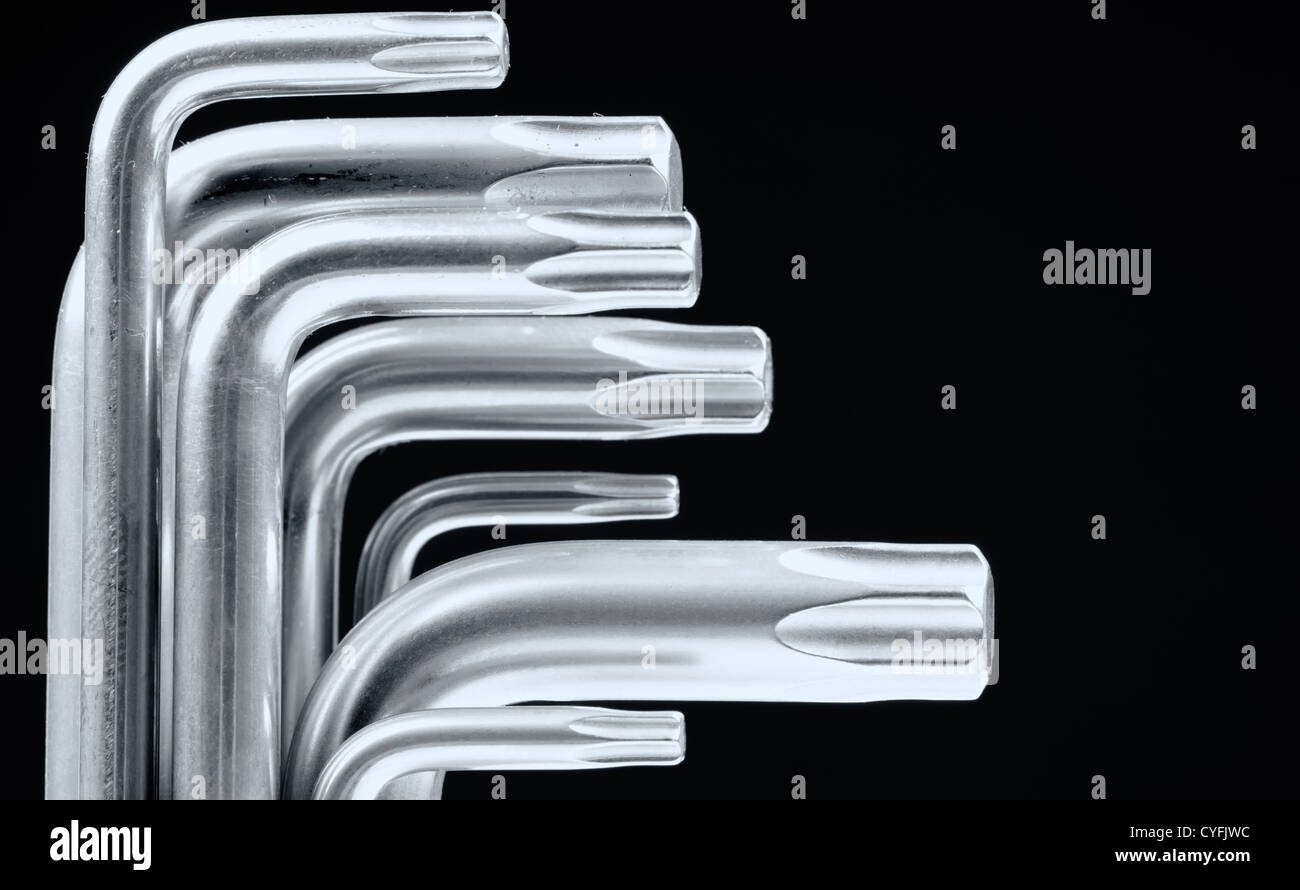 Several different size of Torx keys and black background Stock Photo ...
