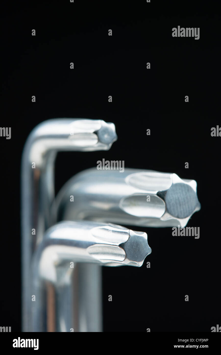 Several different size of Torx keys and black background Stock Photo ...
