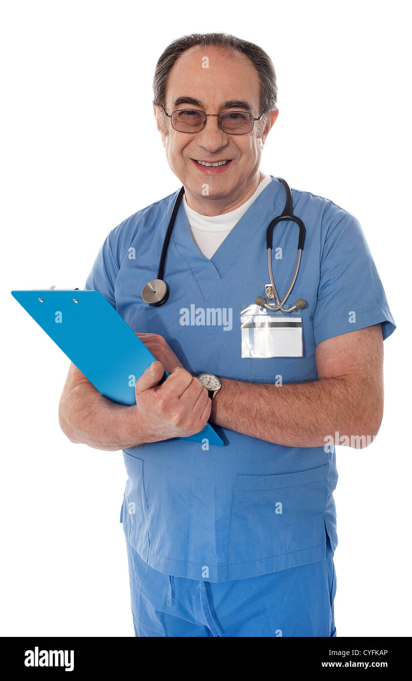 Experienced doctor holding reports and smiling at camera Stock Photo ...