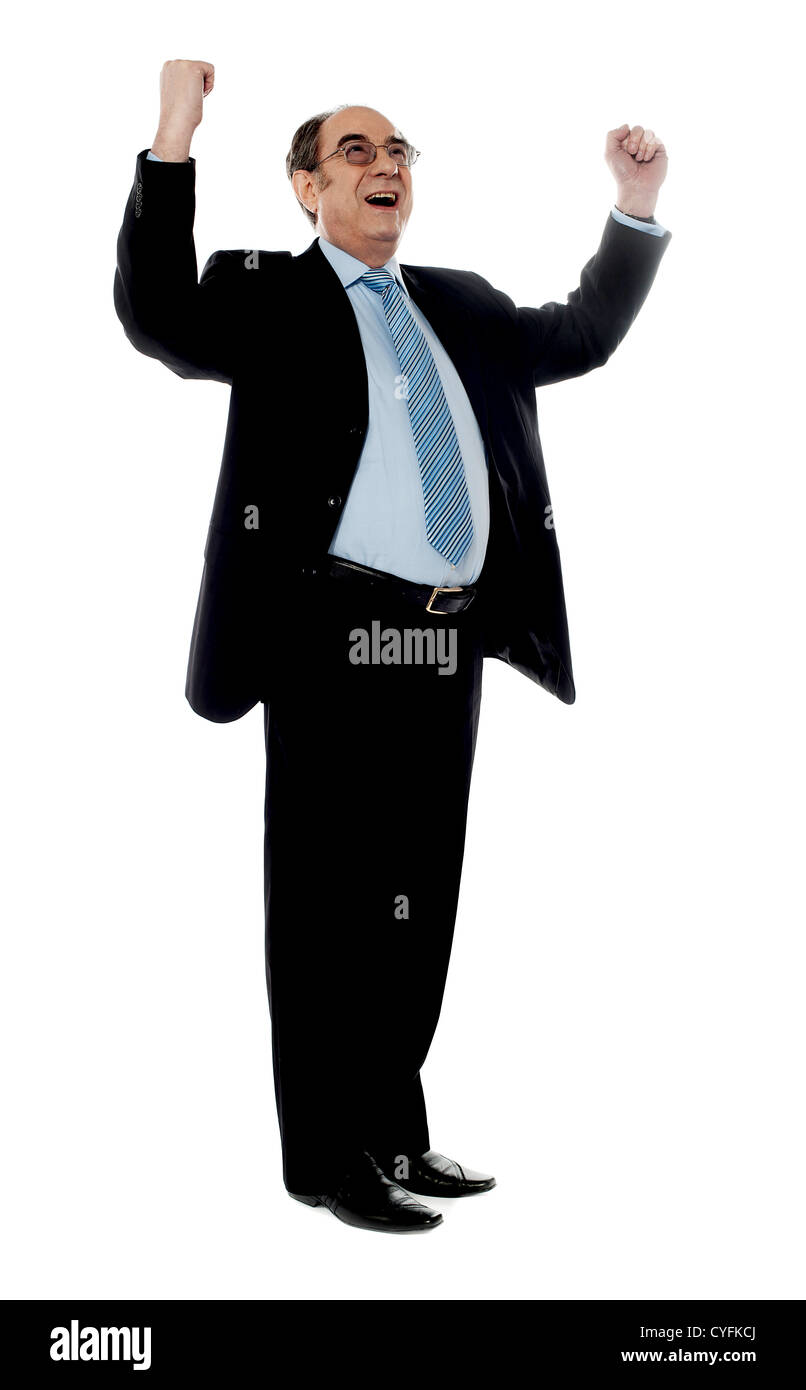 Corporate man standing with arms up against white background Stock ...