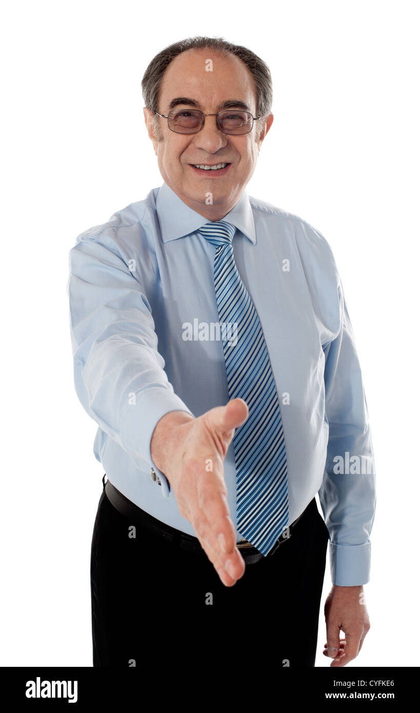 Businessman offering handshake to you, studio shot Stock Photo - Alamy