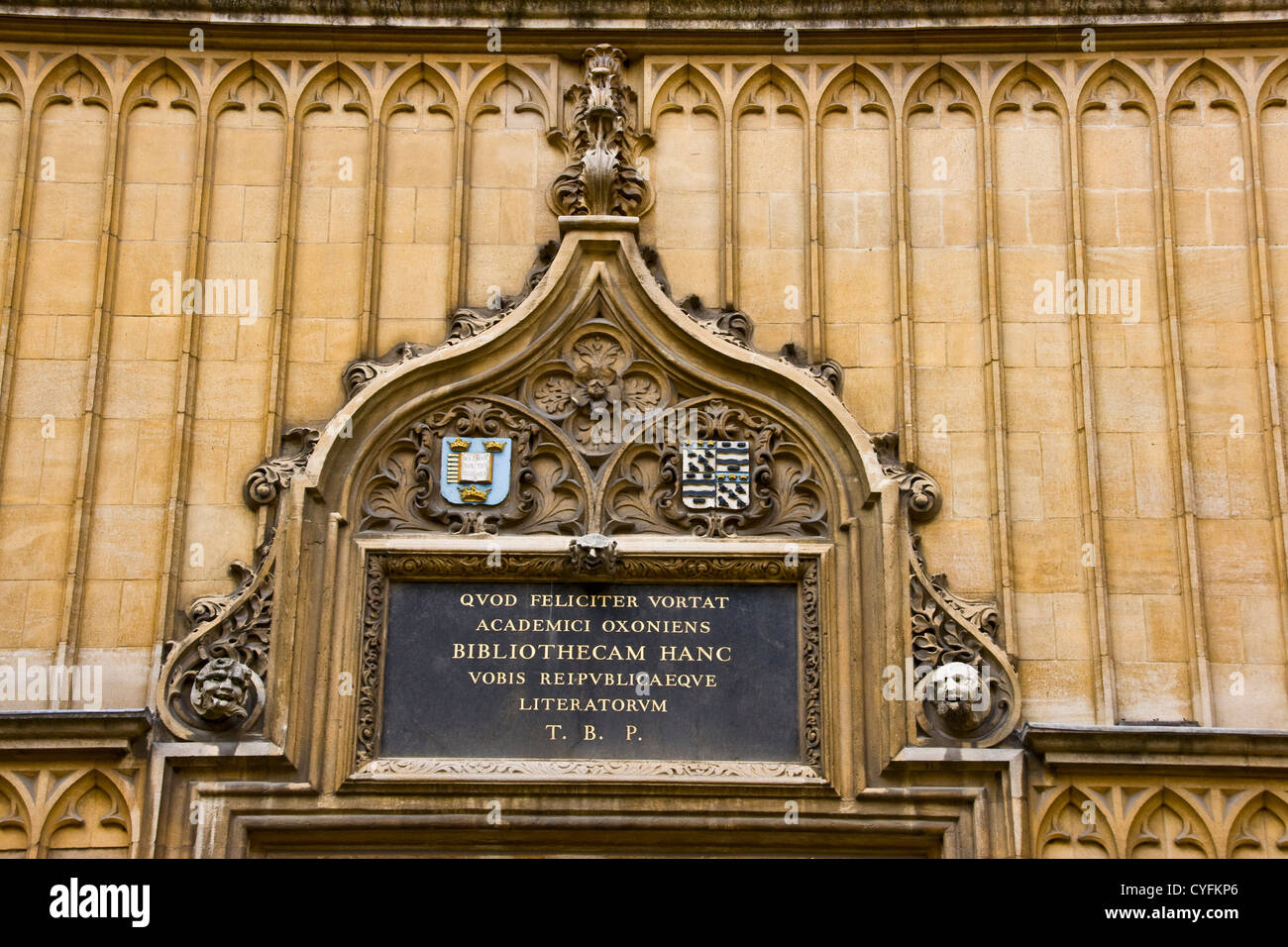 Latin inscription and coat of arms above entrance to grade 1 listed ...