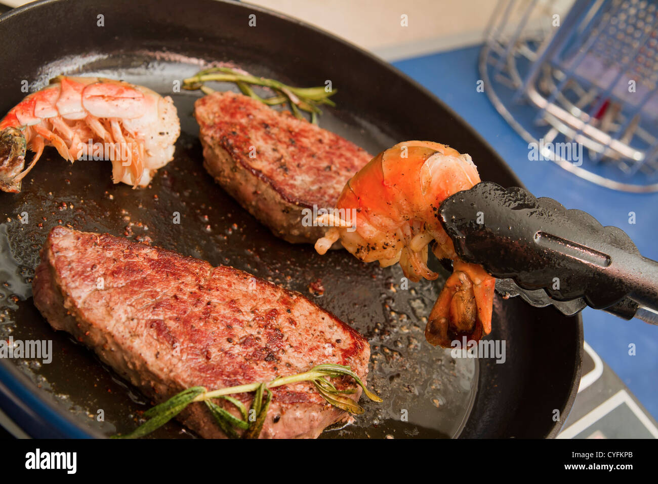 Filet of charolais beef with prawns in a pan Stock Photo - Alamy