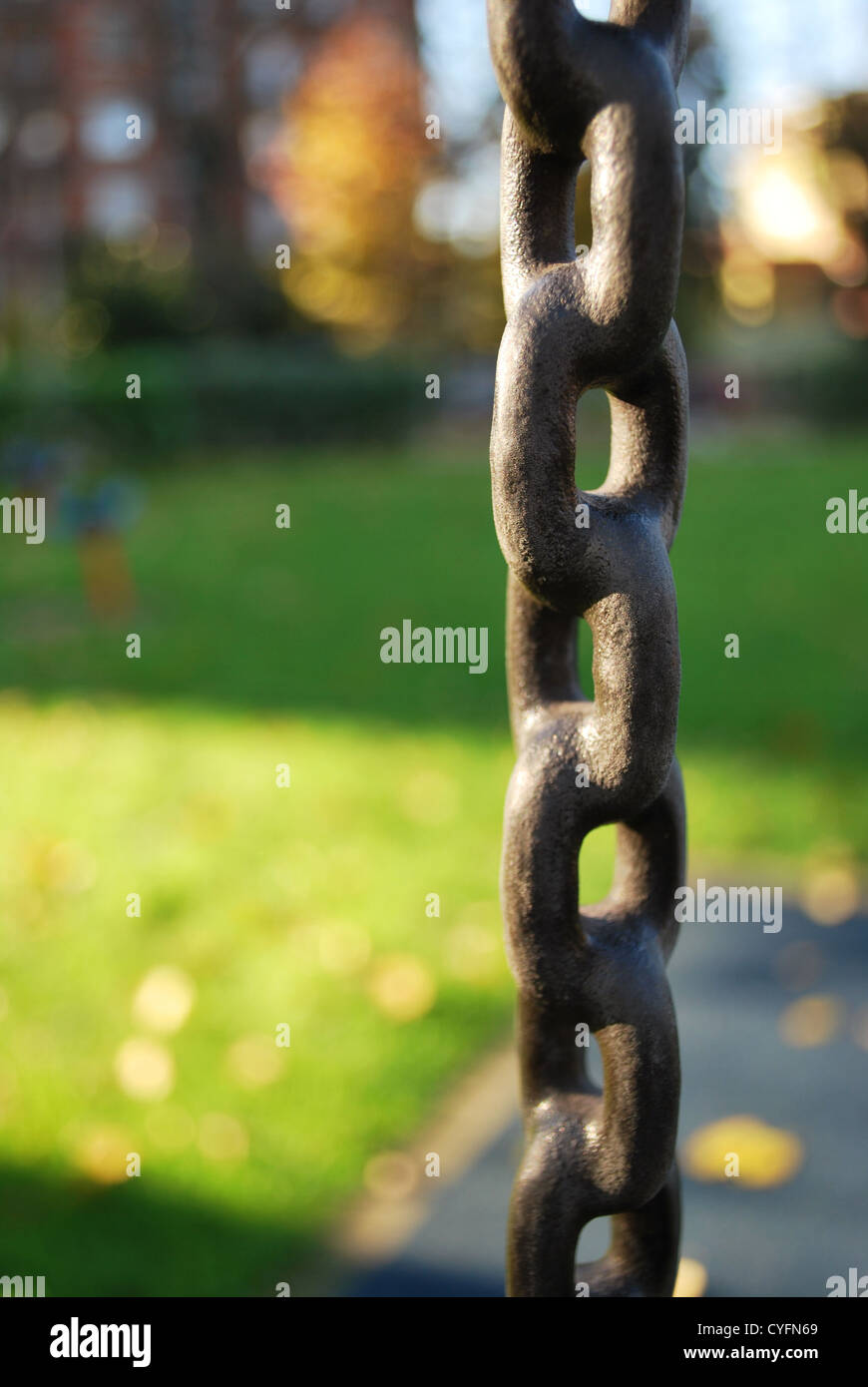 Child's swing chain detail outdoor Stock Photo - Alamy