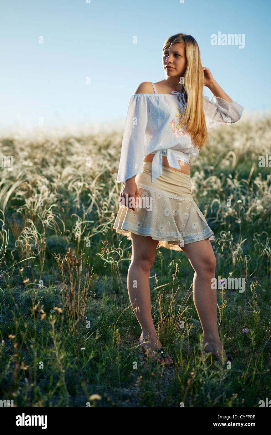 Young girl in field Stock Photo - Alamy
