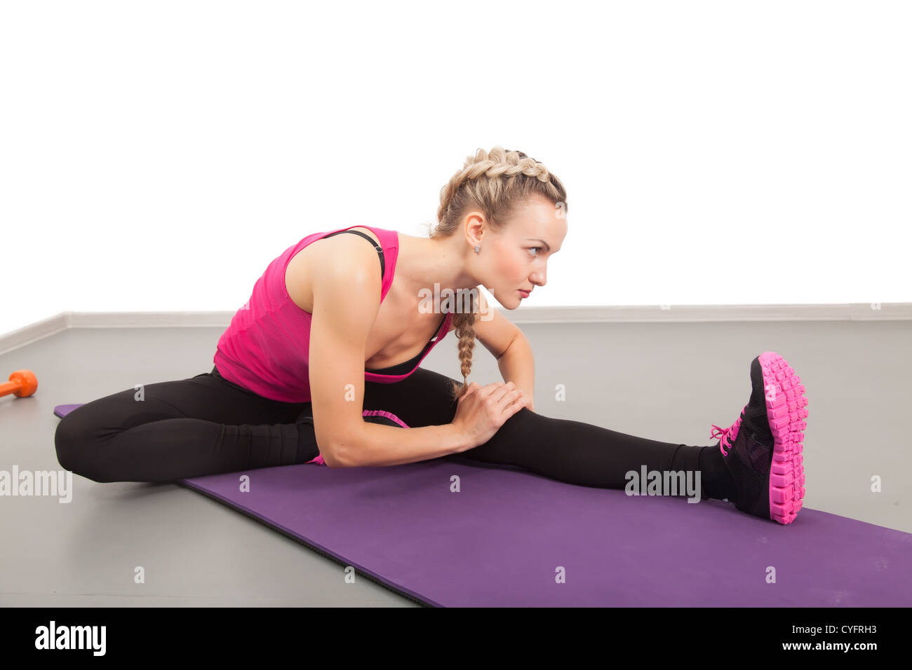 Athletic young woman doing exercises in the gym Stock Photo - Alamy