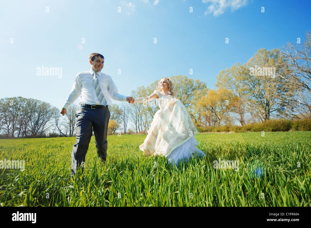 Walking bride and groom Stock Photo - Alamy