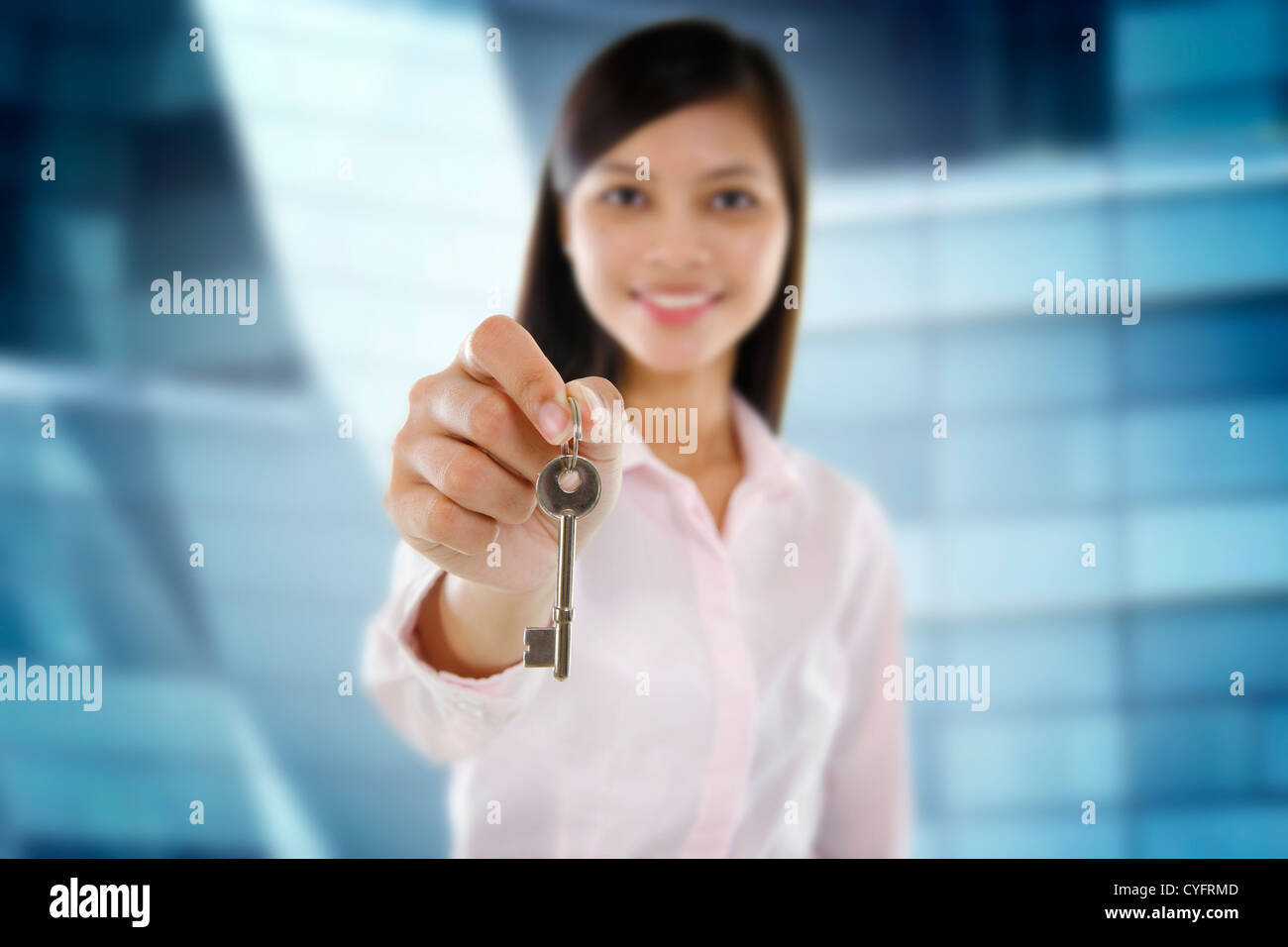 Estate Agent giving out a key Stock Photo - Alamy