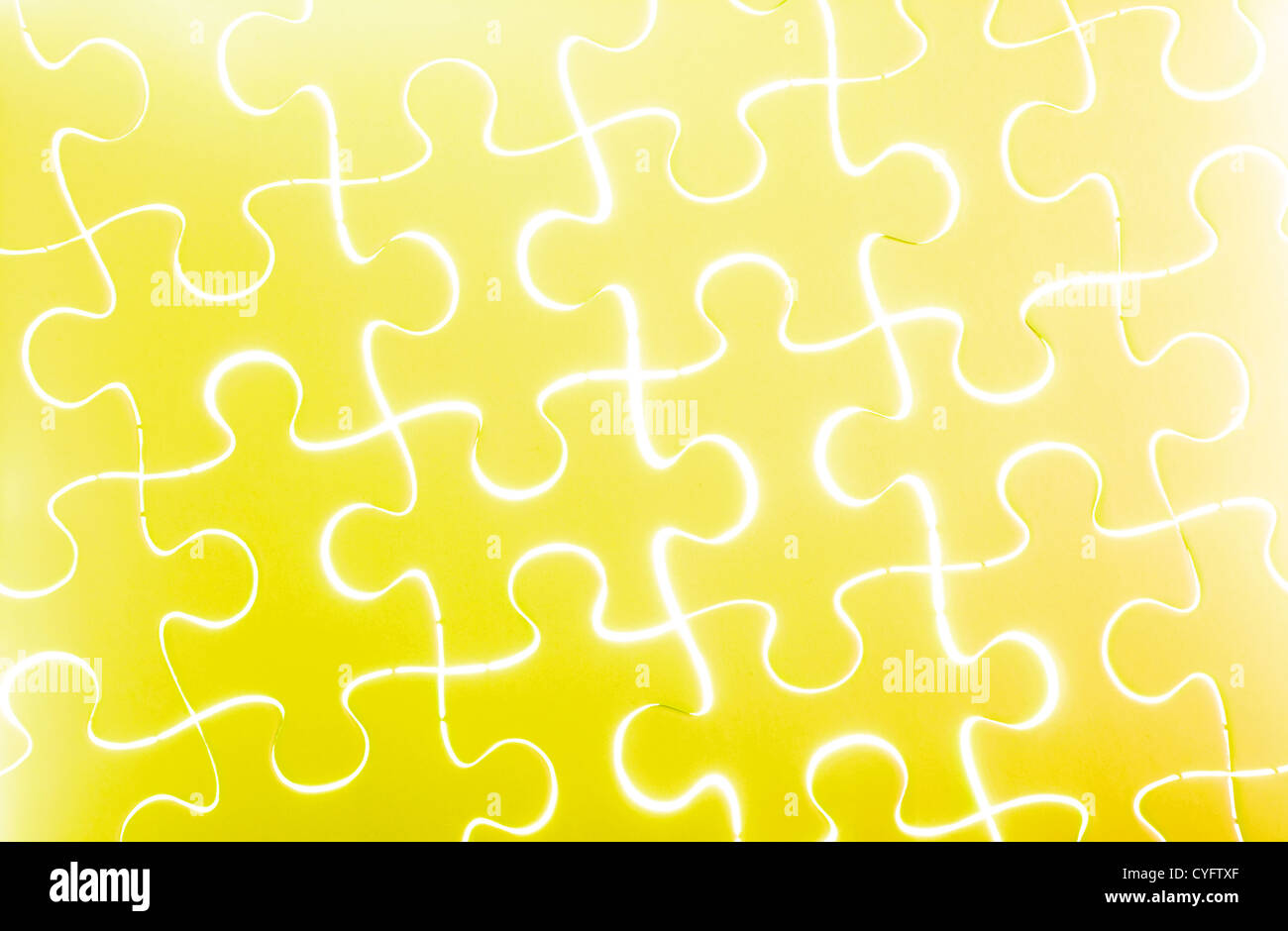 Puzzle in yellow Stock Photo - Alamy