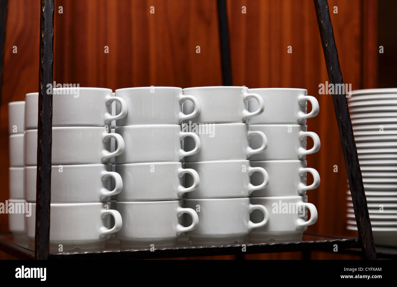 Stack of clean white ceramic cups in a restaurant kitchen Stock Photo ...