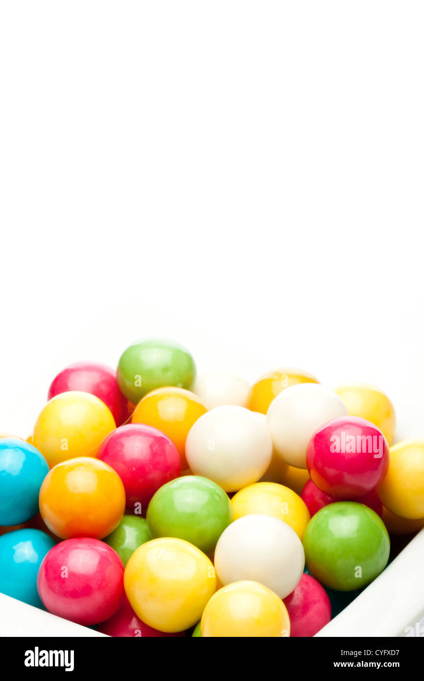 many colored gumballs on a white background Stock Photo - Alamy