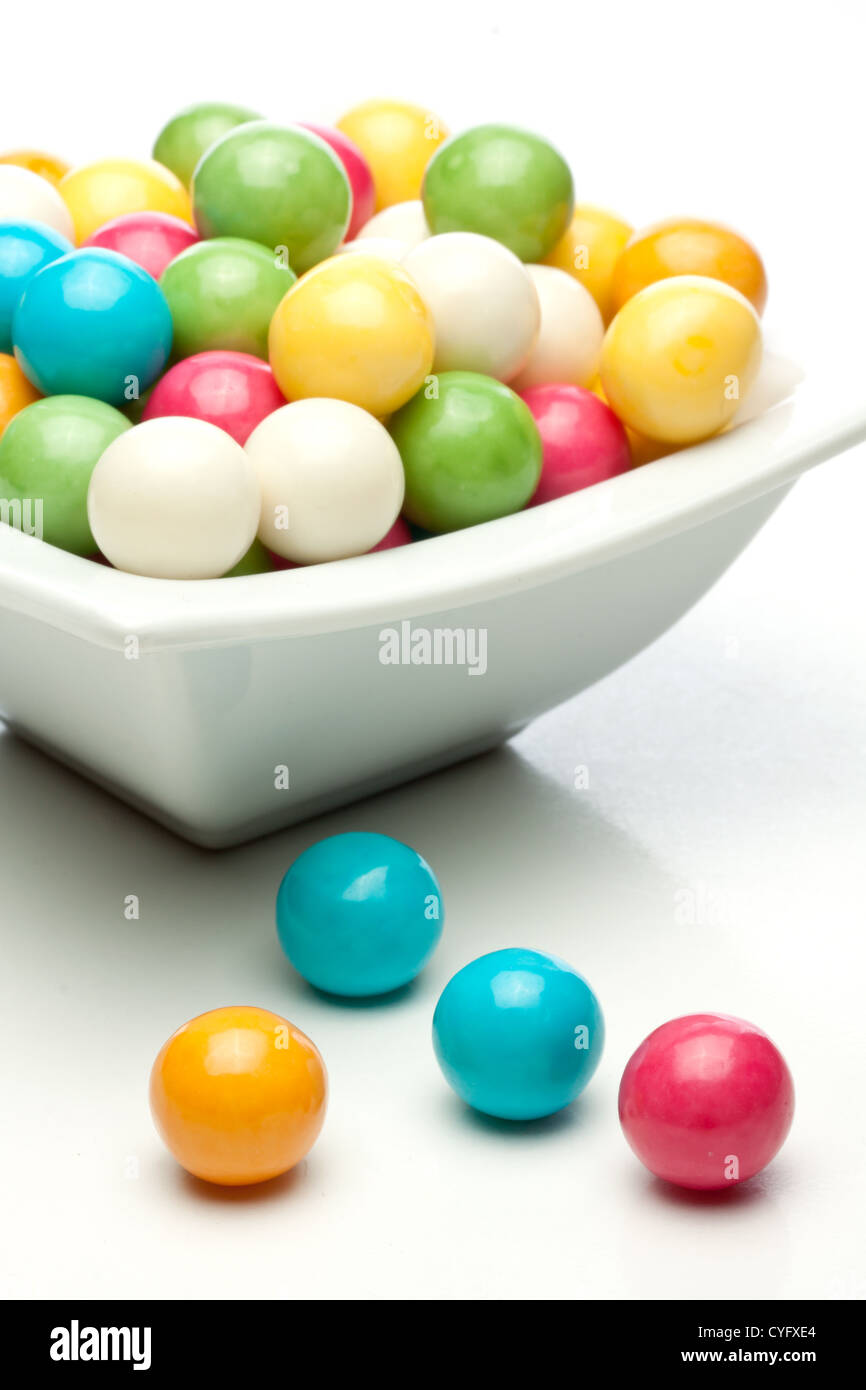 many colored gumballs on a white background Stock Photo - Alamy