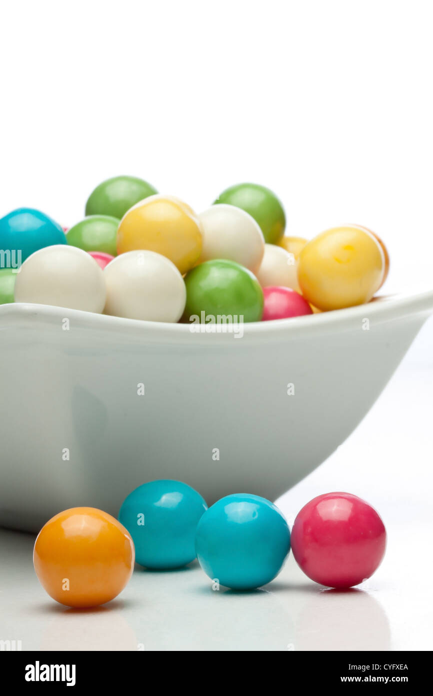 many colored gumballs on a white background Stock Photo - Alamy